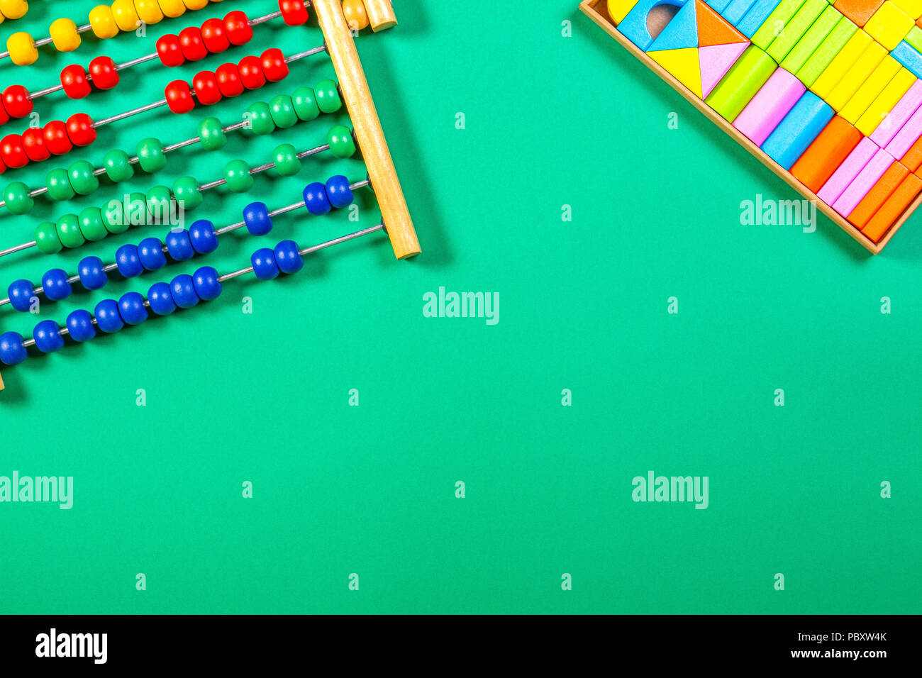 Kids toys background with abacus and wooden cubes Stock Photo - Alamy