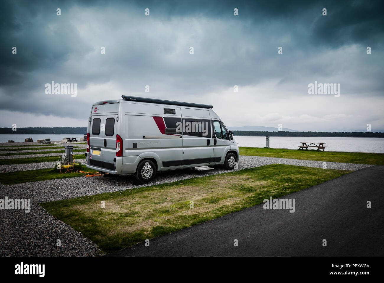 A single camper van parked on a campsite in Norway Stock Photo - Alamy