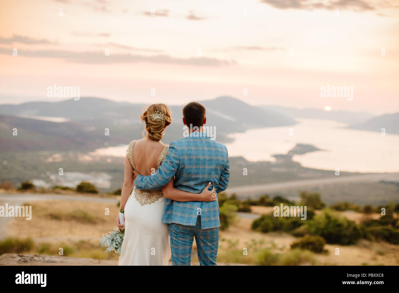 couple relax at sunset with beautiful view. Sun and horizon view ...