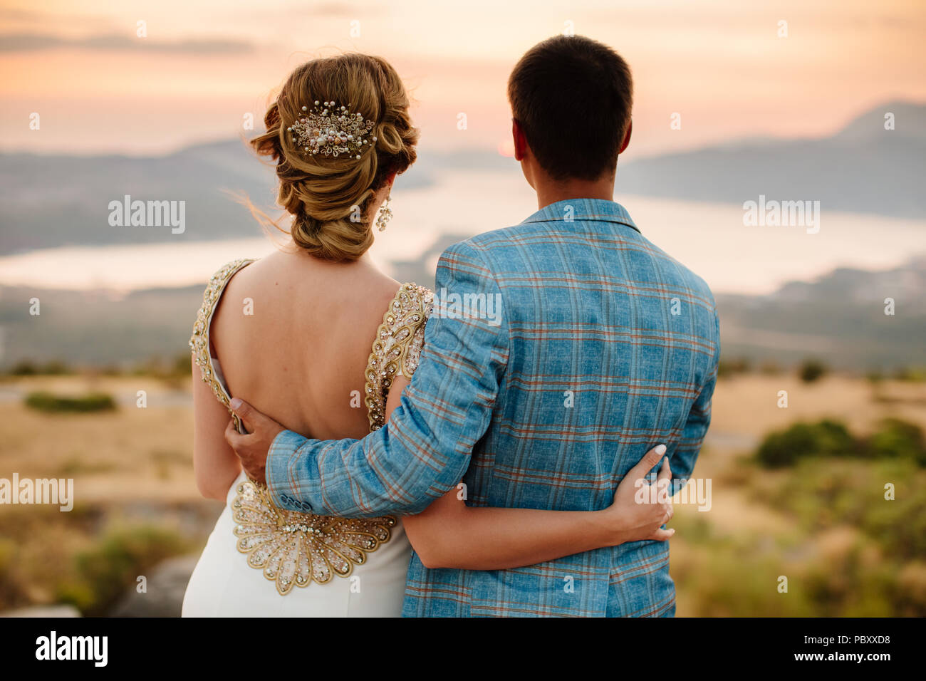 couple relax at sunset with beautiful view. Sun and horizon view ...