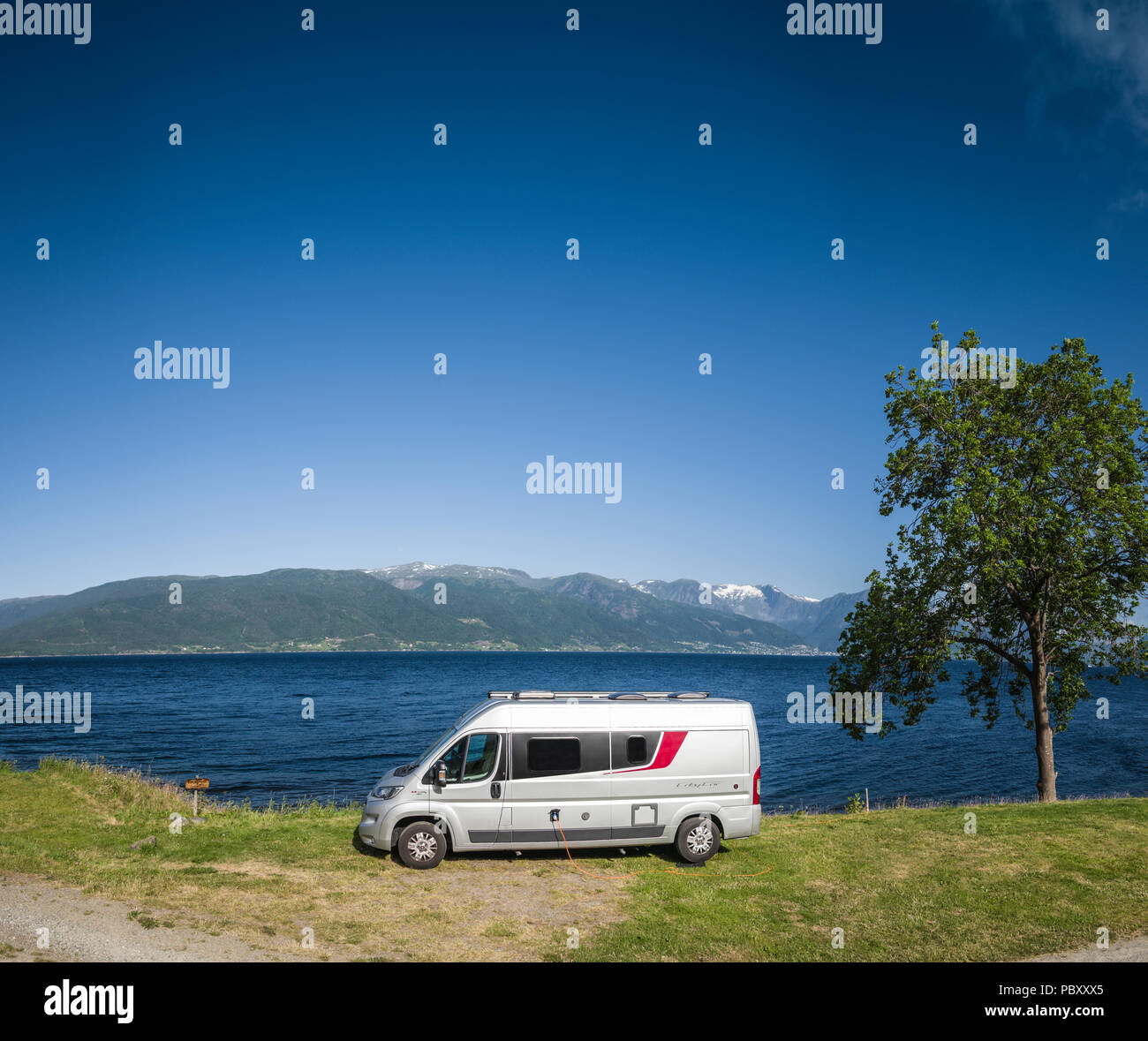 A single camper van parked on a campsite in Norway Stock Photo - Alamy