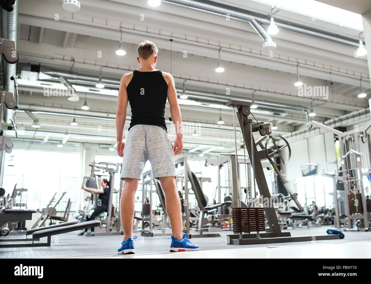 Young man standing in gym hi-res stock photography and images - Alamy