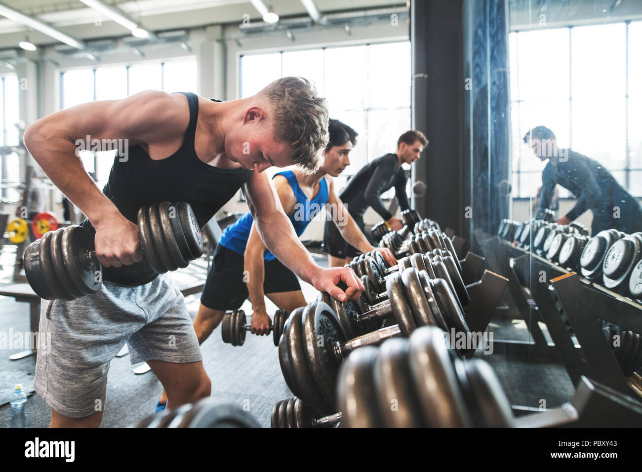 Handsome men exercising in gym hi-res stock photography and images - Alamy