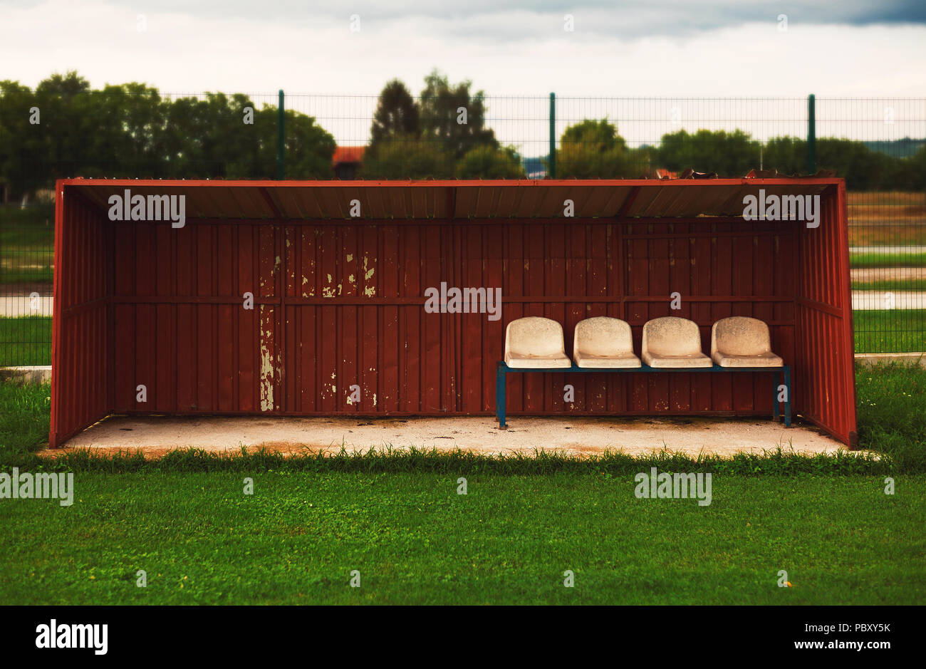 Bench for reserve football players, old and ruined during day Stock ...