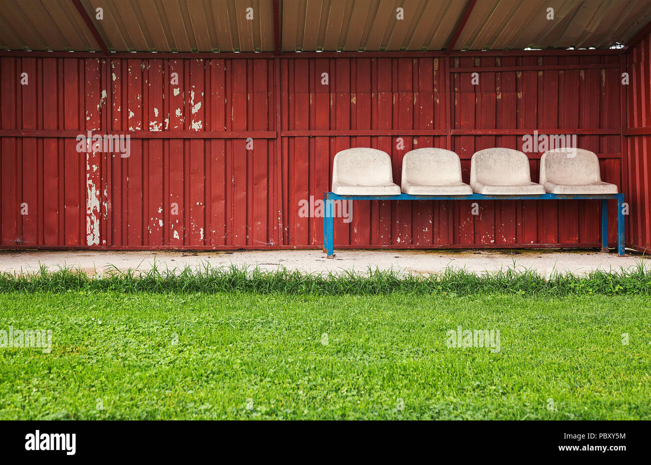 Bench for reserve football players, old and ruined during day Stock ...