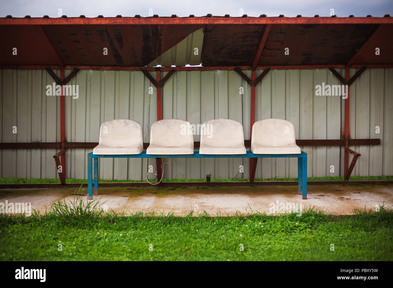 Bench for reserve football players, old and ruined during day Stock ...