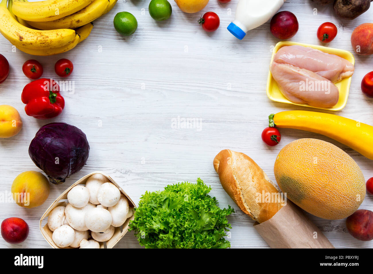 Frame of healthy food on white wooden table. Cooking food background ...