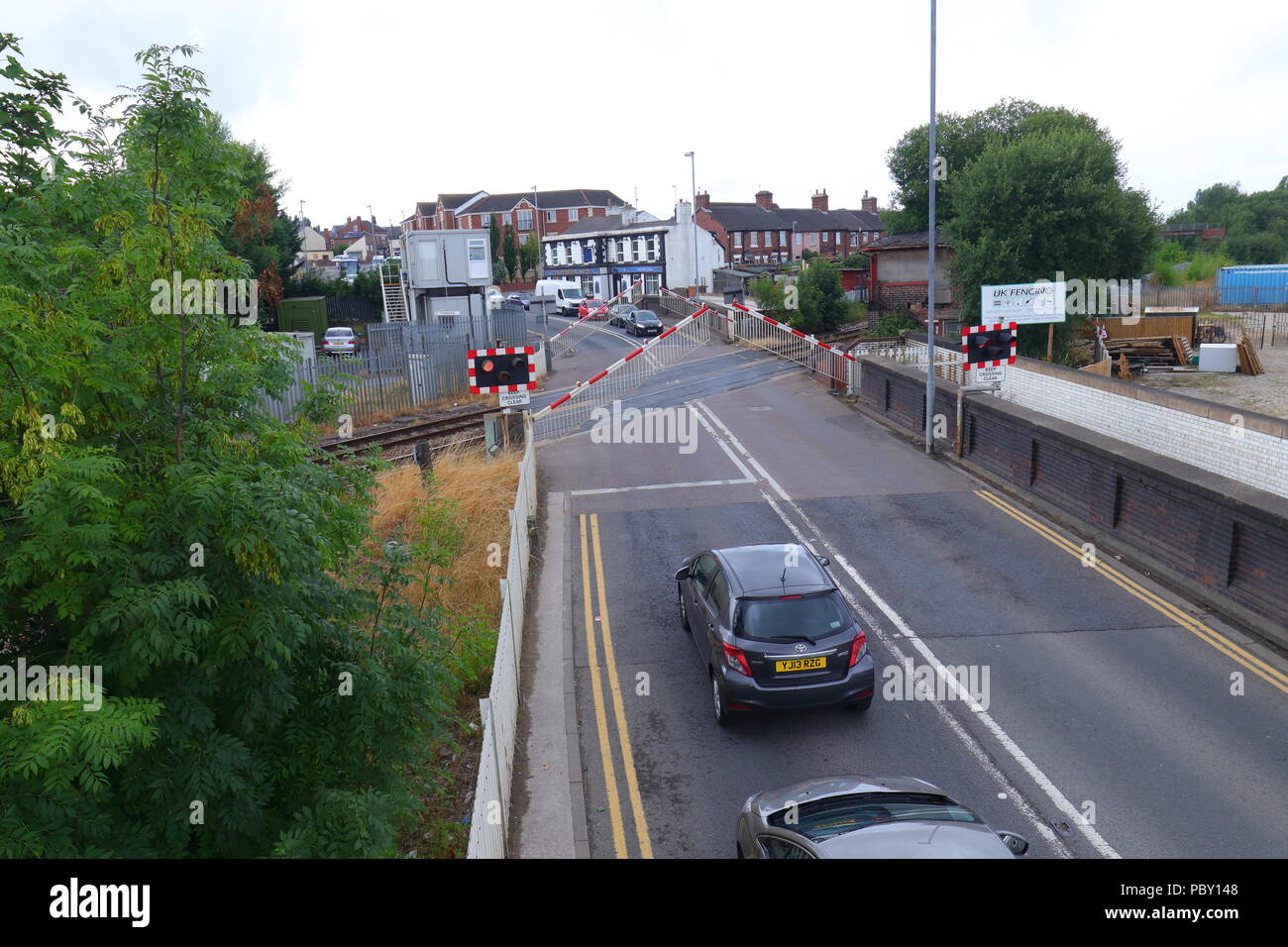 Partly opened level crossing barriers hi-res stock photography and ...