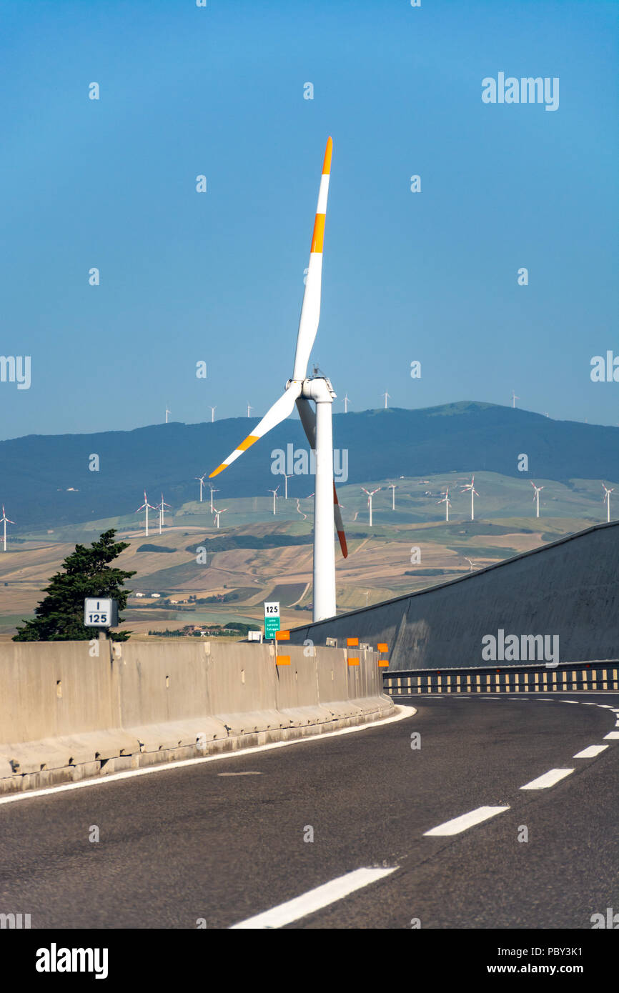 Modern wind farm with big wind turbines towers, source for renewable ...