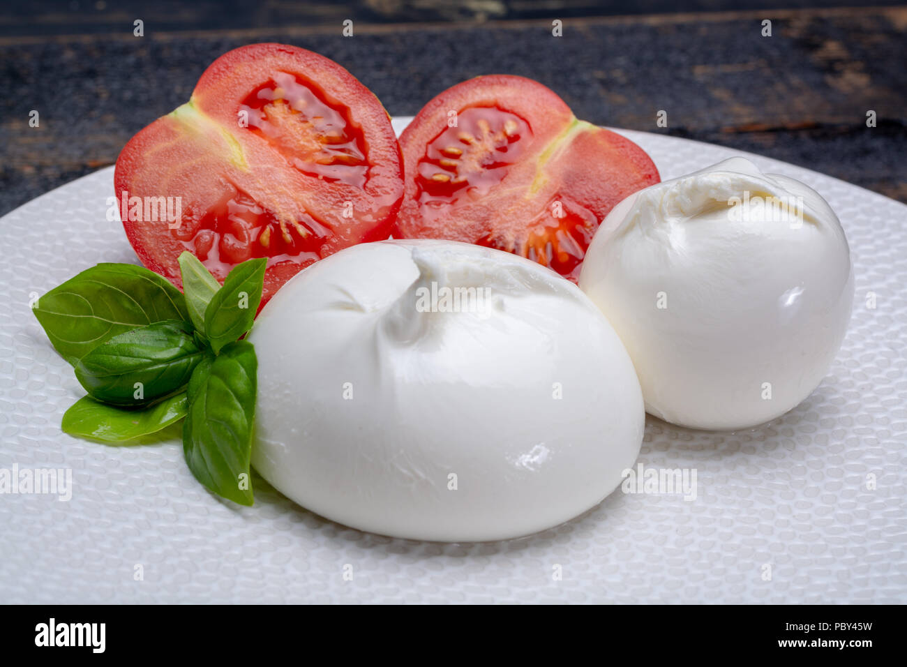 Fresh soft white burrata, ball buttery cheese, made from a mix of ...