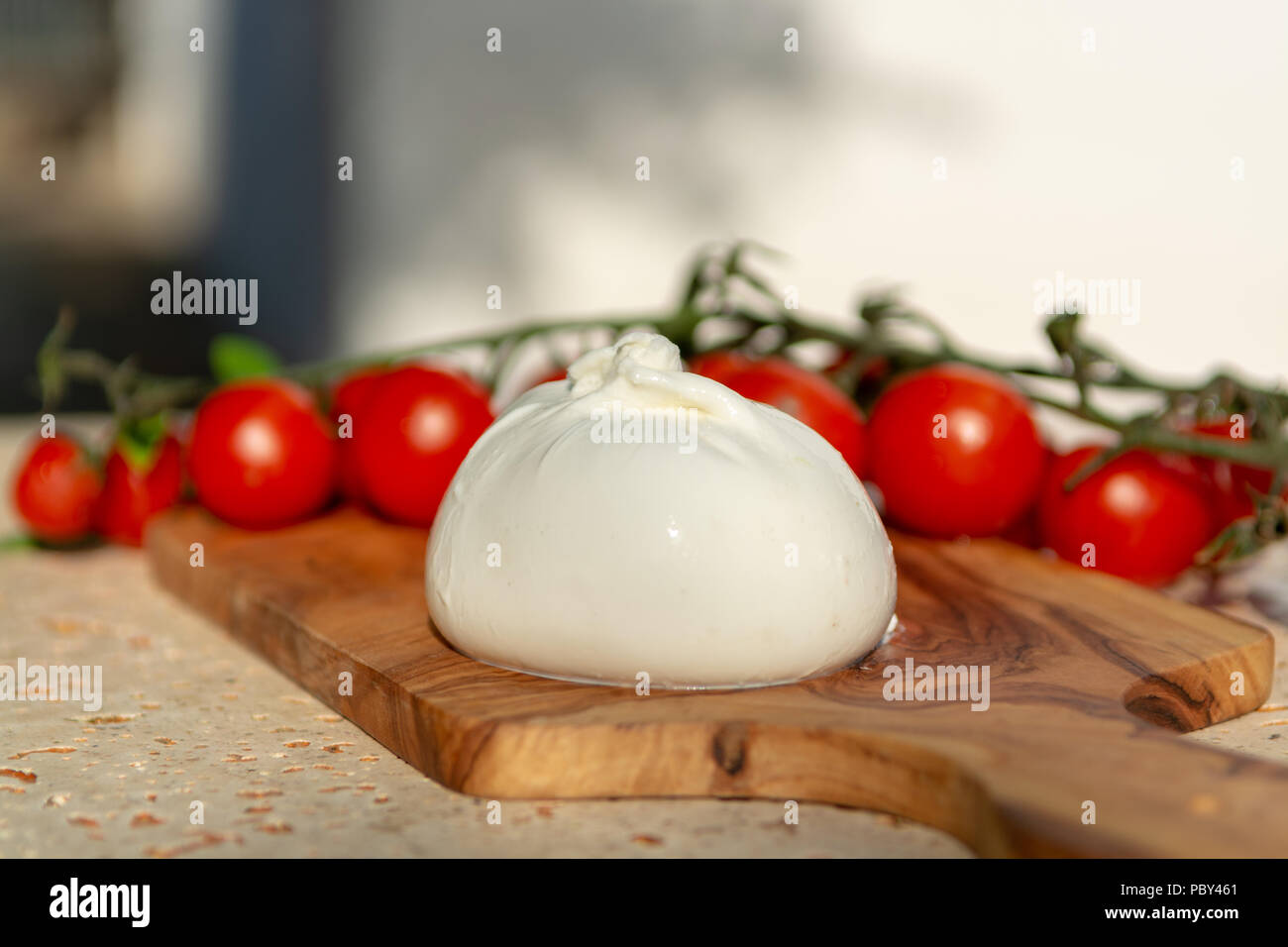 Fresh soft white burrata, buttery cheese, made from a mix of mozzarella ...