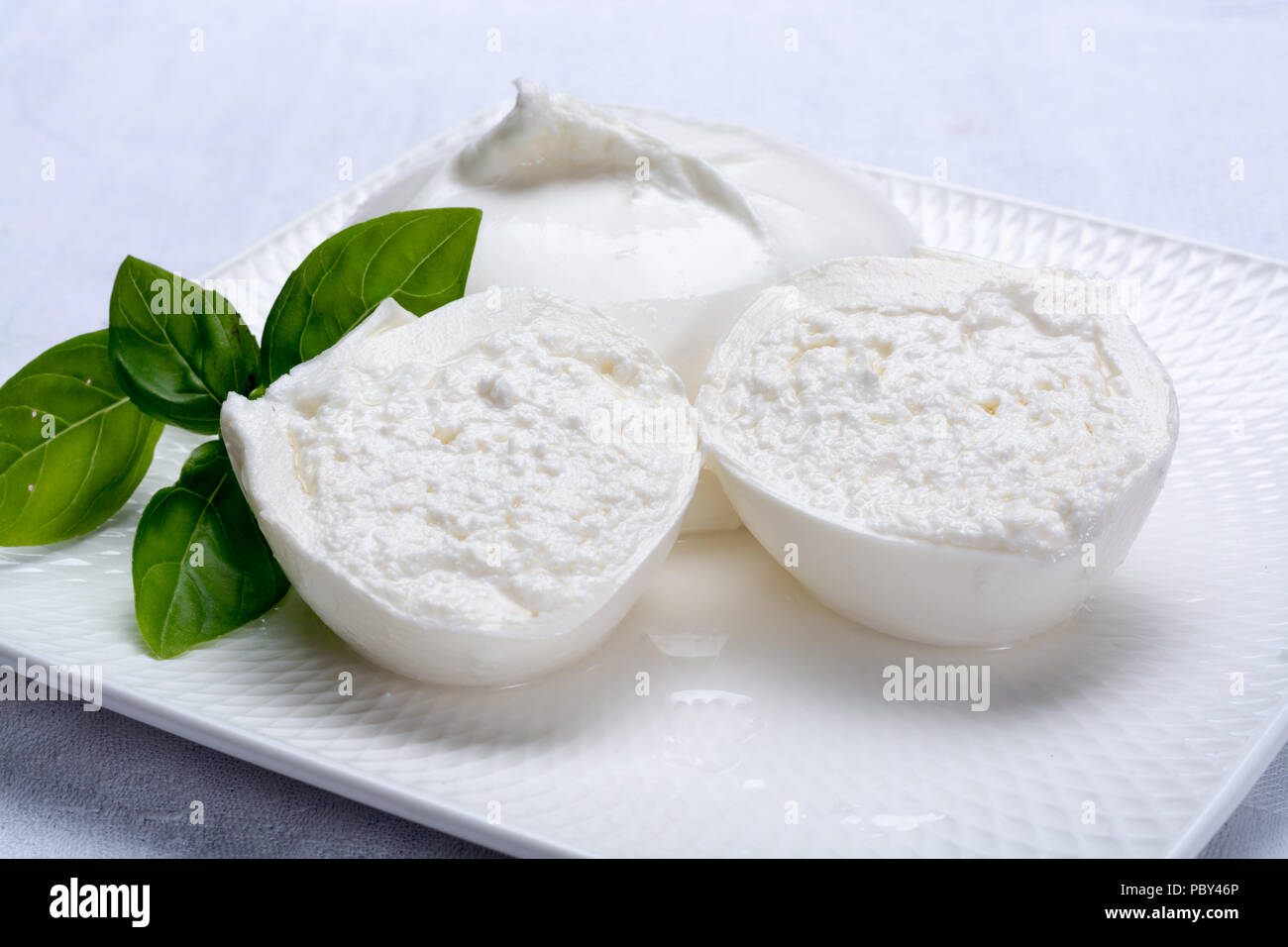 Fresh soft white burrata, ball buttery cheese, made from a mix of ...