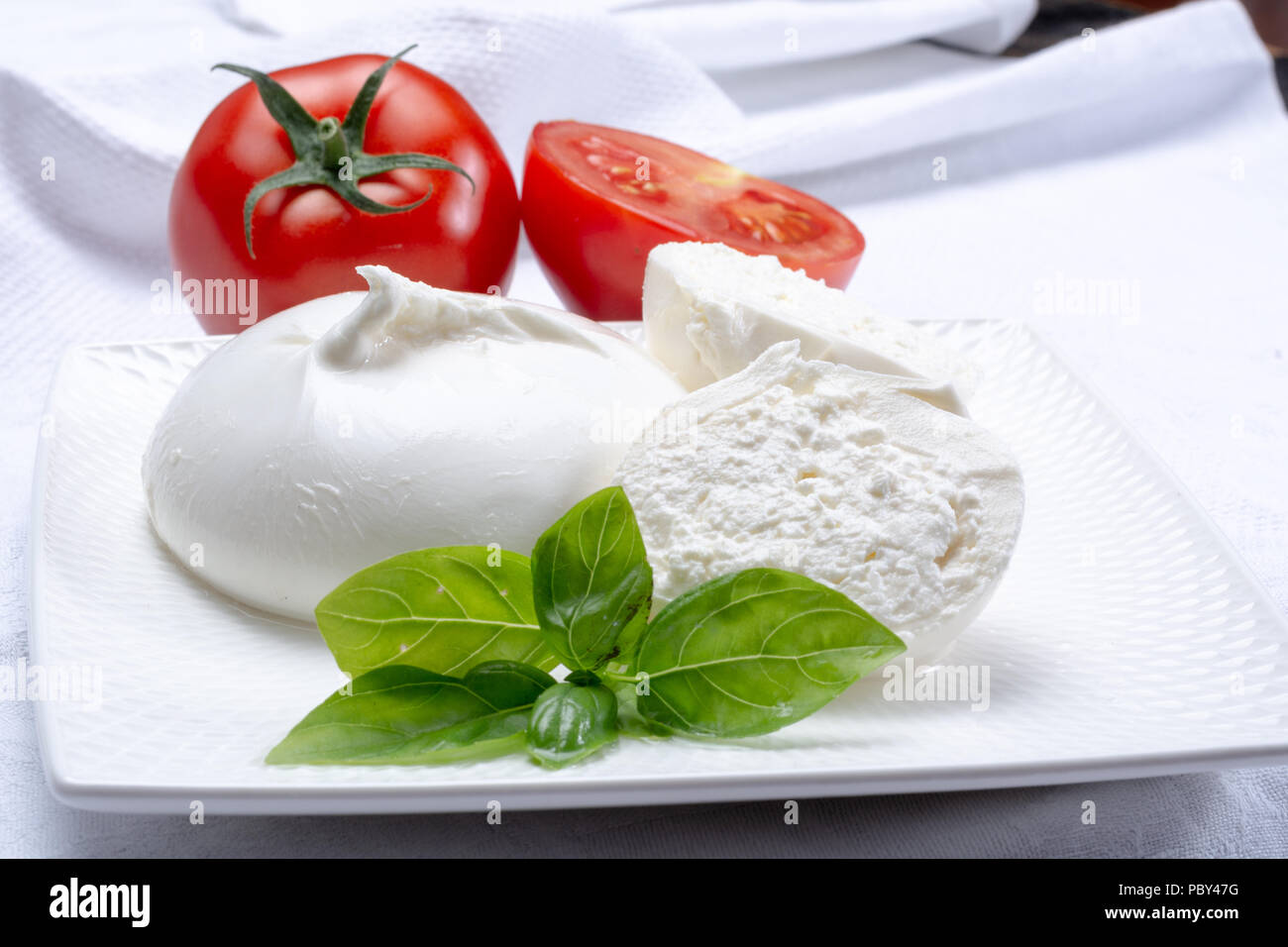 Fresh soft white burrata, ball buttery cheese, made from a mix of ...