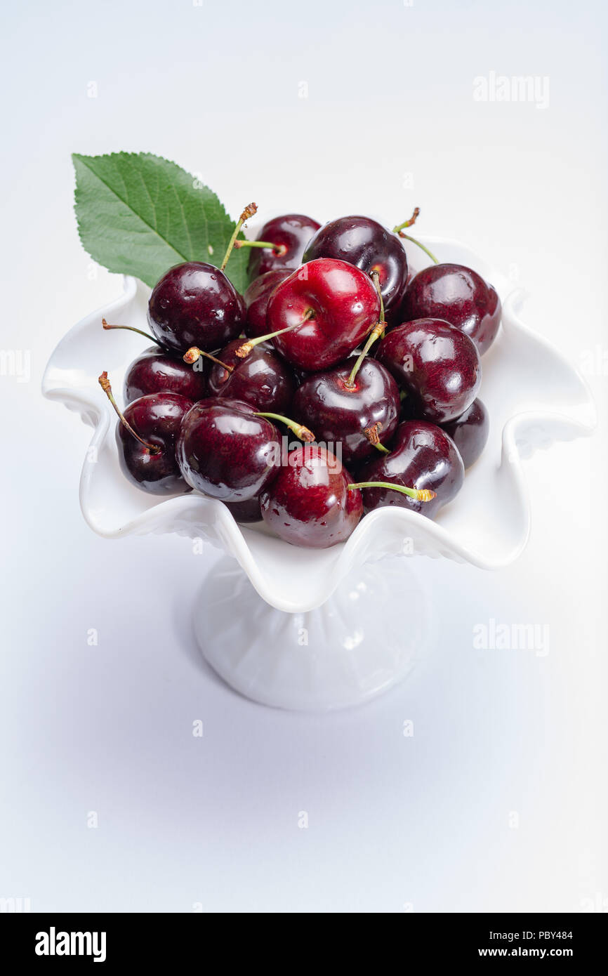 Giant fresh ripe black cherries, new harvest, ready to eat close up ...