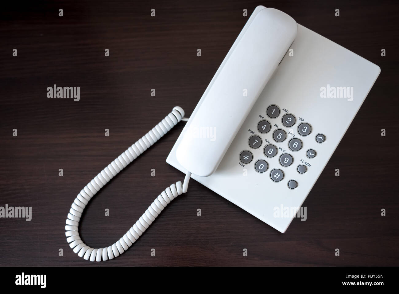 white telephone on wooden background Stock Photo - Alamy