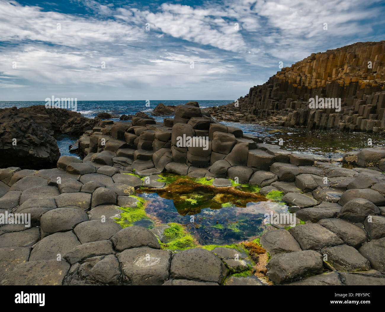 Colorful rock formations of Causeway overlooking the Atlantic Ocean and ...