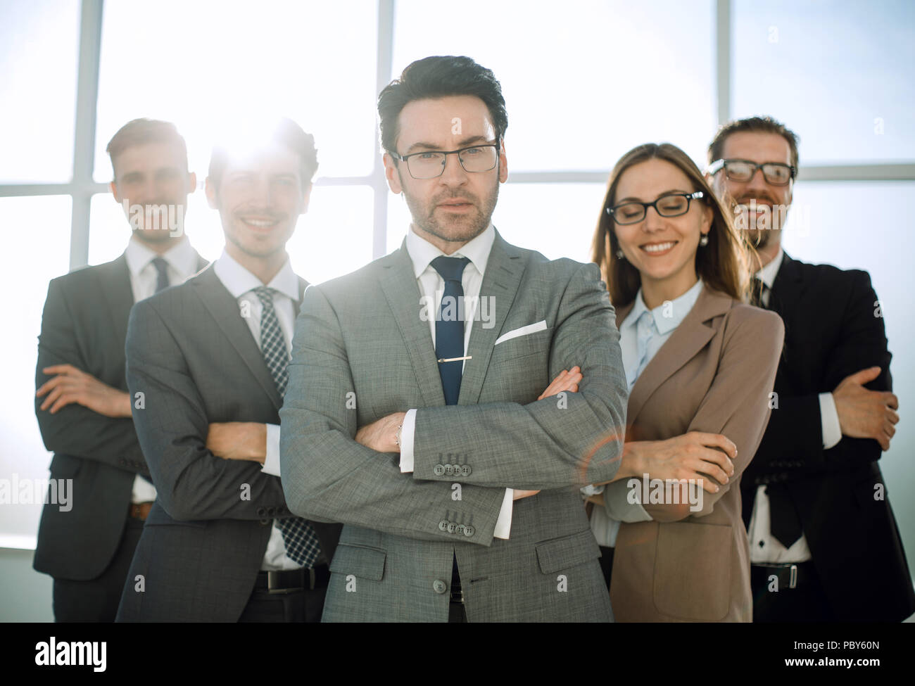 Happy sales team standing hi-res stock photography and images - Alamy