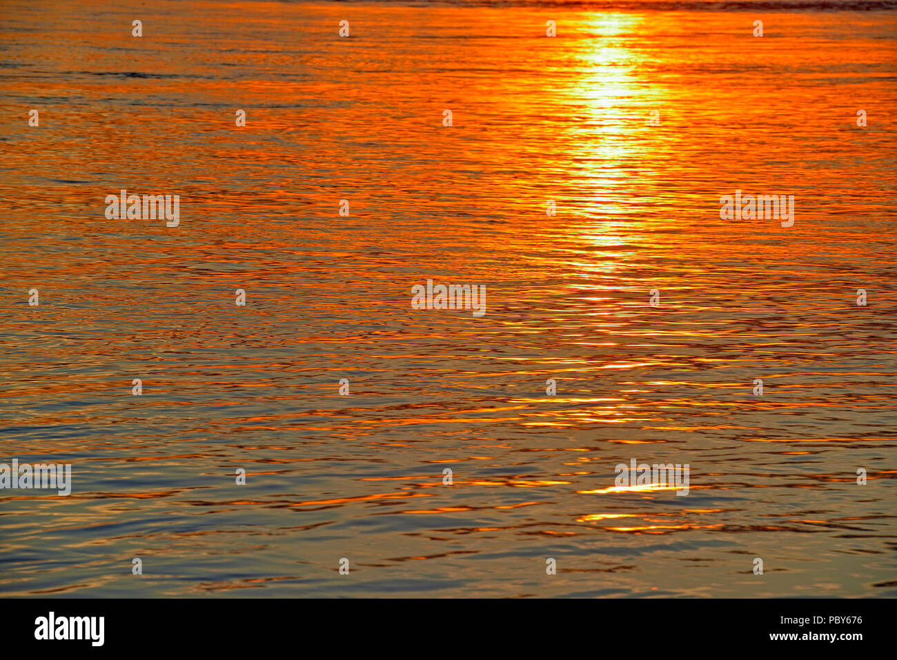 Setting sun reflected in the MacKenzie River, Fort Providence ...