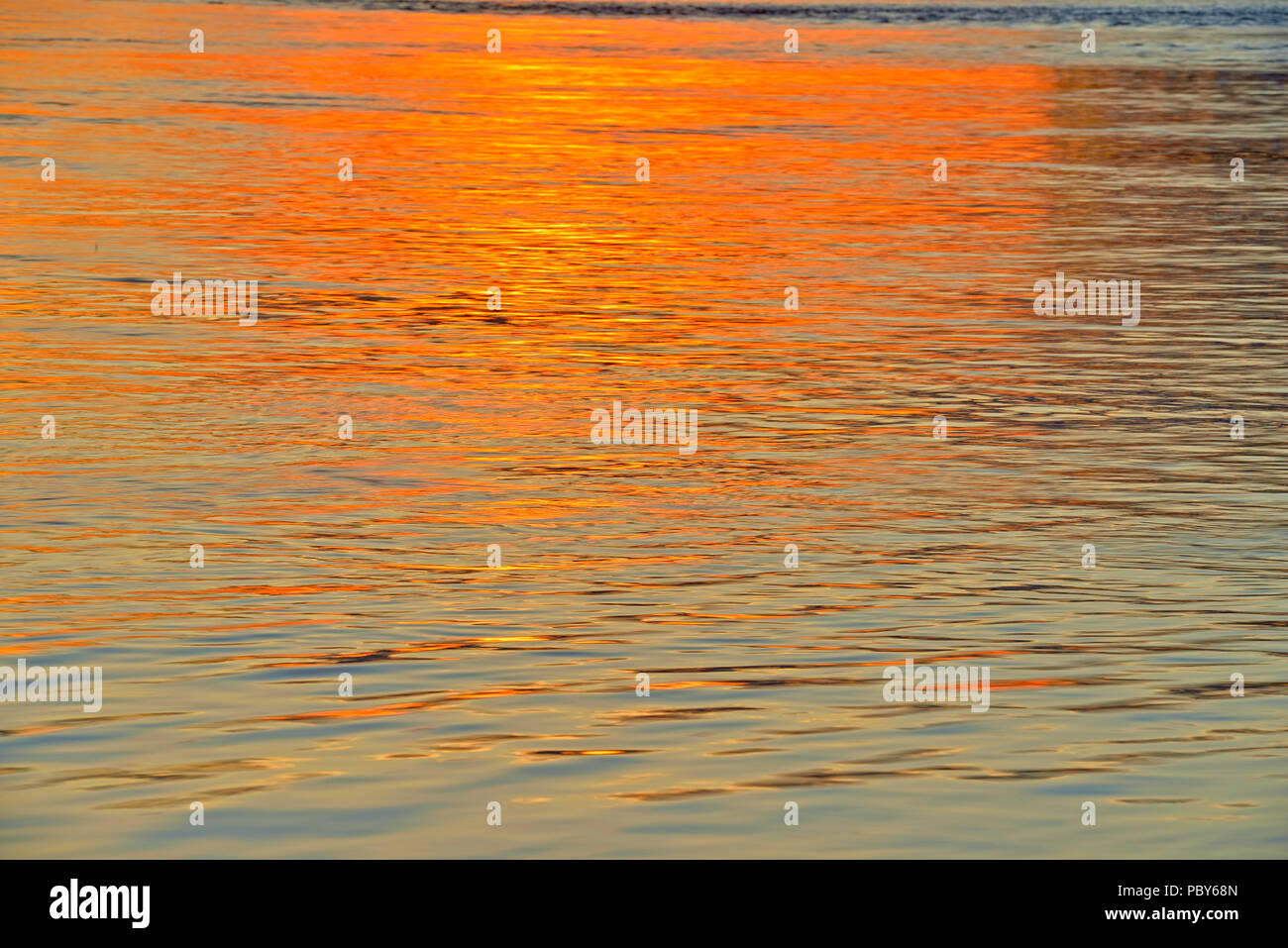 Setting sun reflected in the MacKenzie River, Fort Providence ...