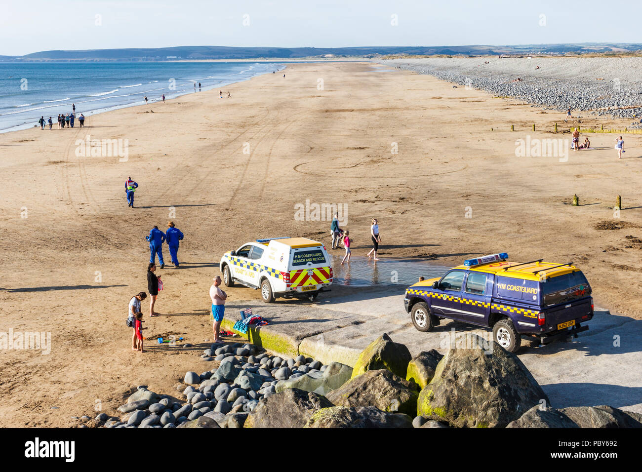 HM Coastguard search and rescue teams responding to an incident on the ...