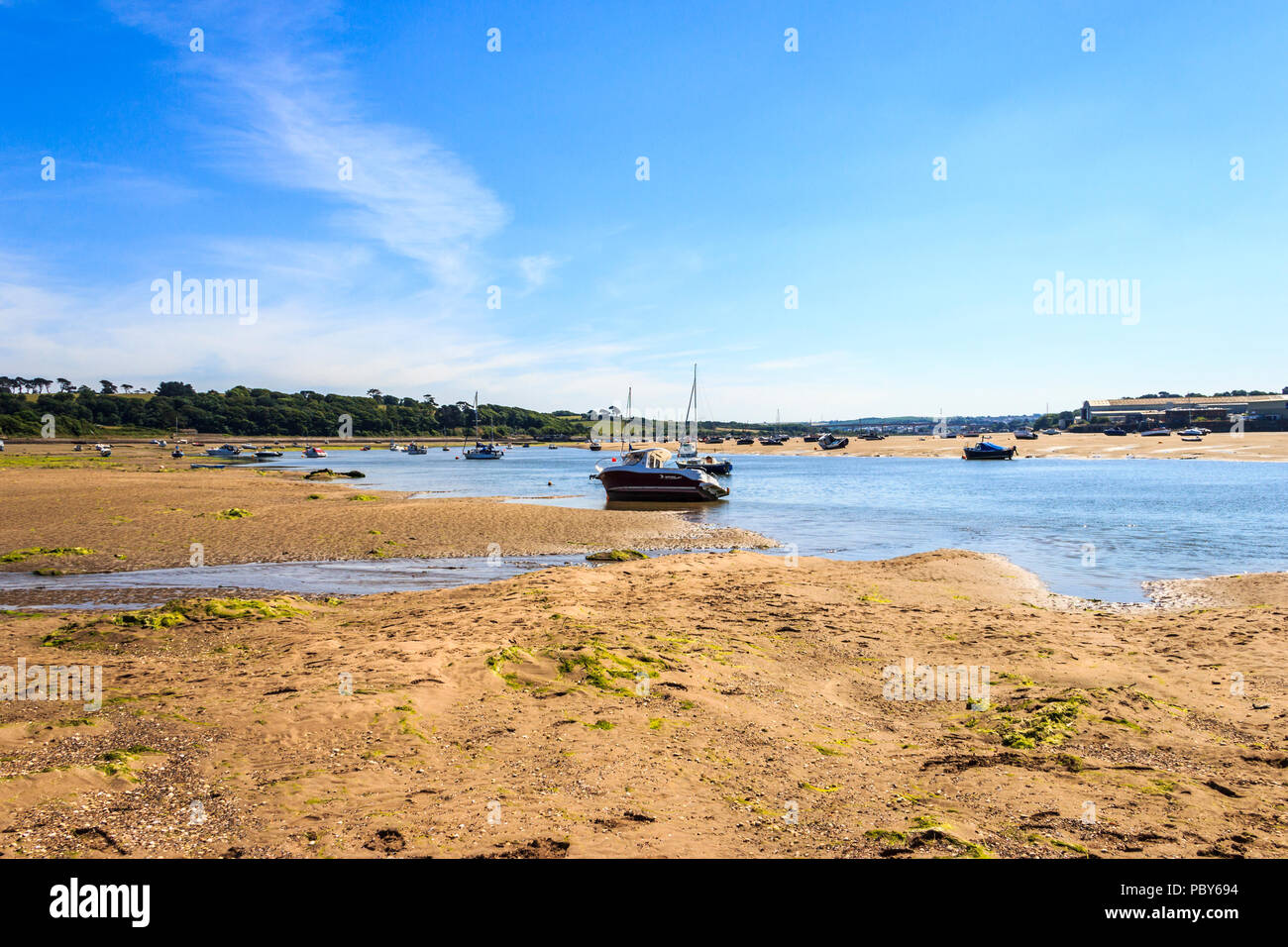 Boats on the beach in the Torridge estuary at Instow, Devon, UK, at low ...