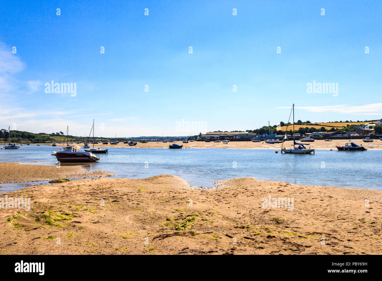 Boats on the beach in the Torridge estuary at Instow, Devon, UK, at low ...
