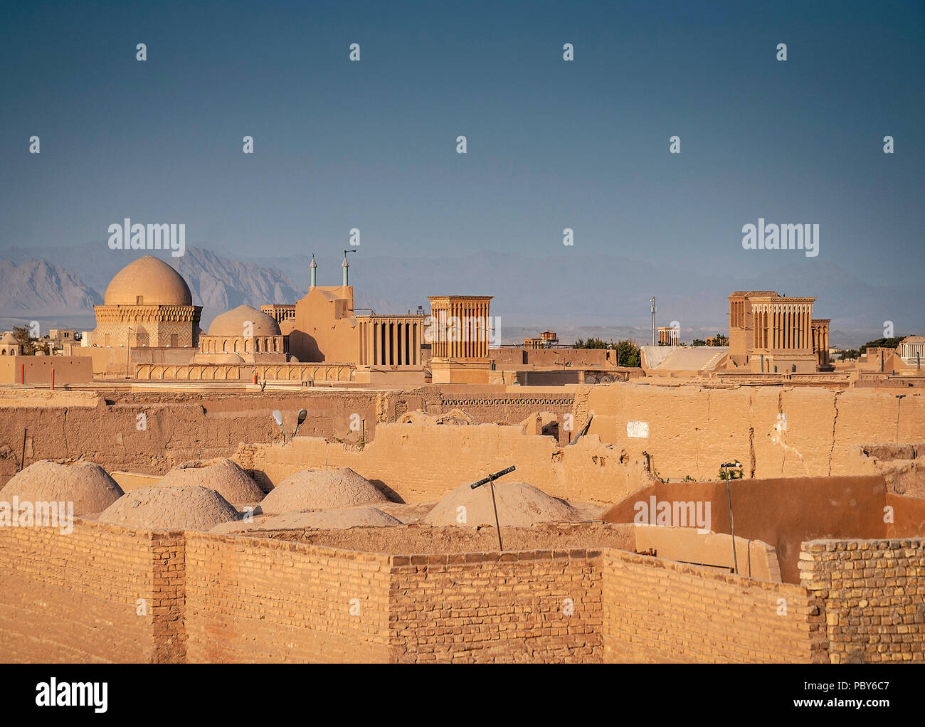 downtown rooftops wind towers and landscape view of yazd city old town ...