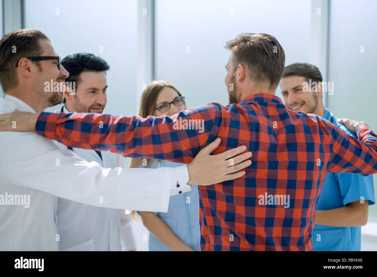 friendly male medical doctor greeting patient Stock Photo - Alamy