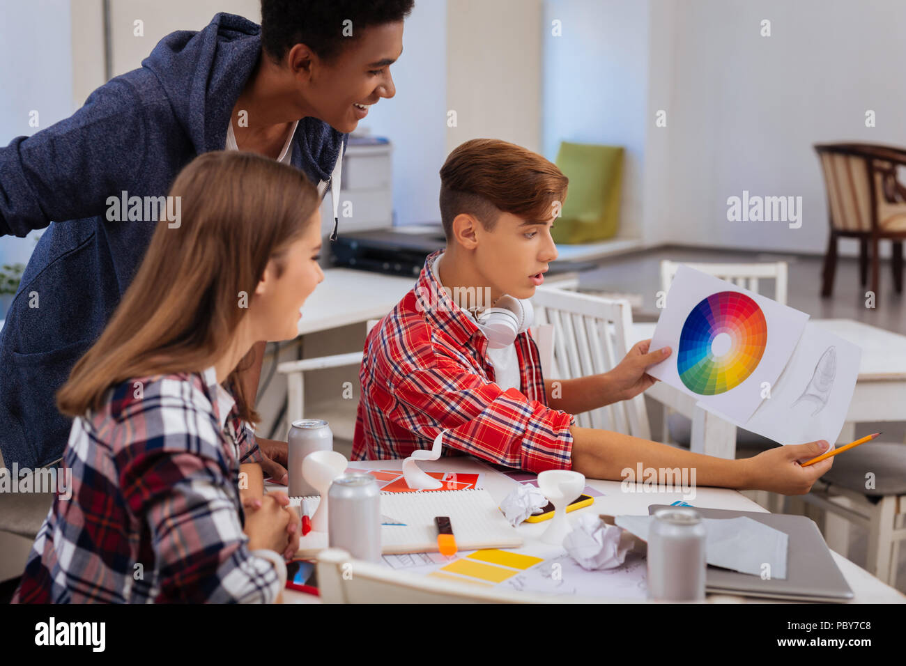 Promising creative art students looking at color palette Stock Photo ...