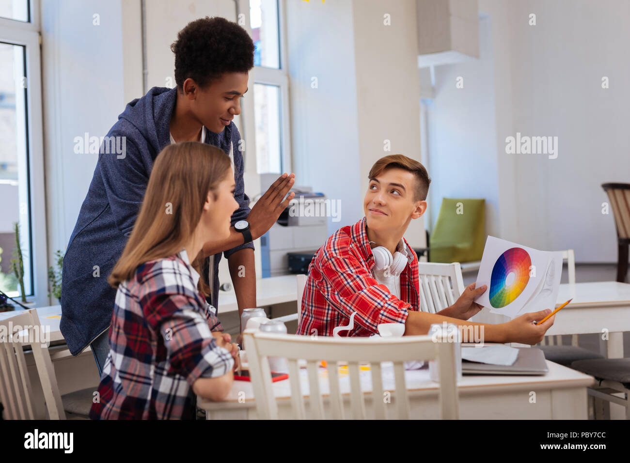 Two friends feeling proud of promising engineer Stock Photo - Alamy