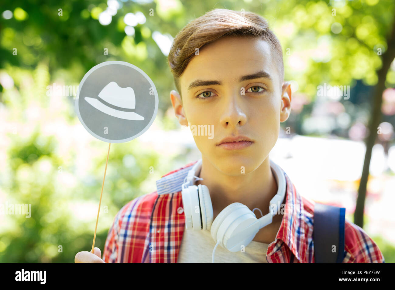 Serious young man gathering available information Stock Photo - Alamy
