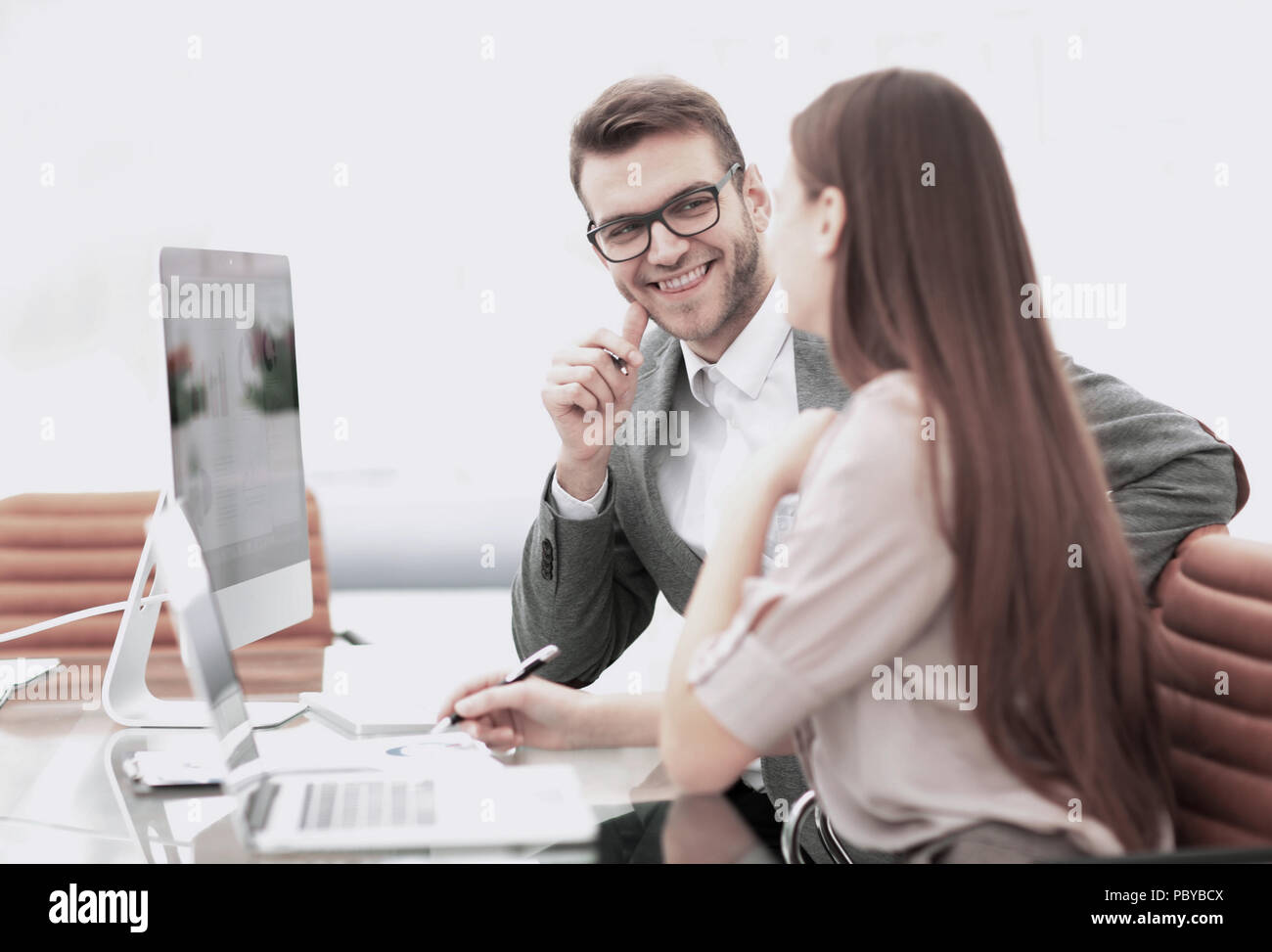 Two managers in a business meeting analyzing data Stock Photo - Alamy