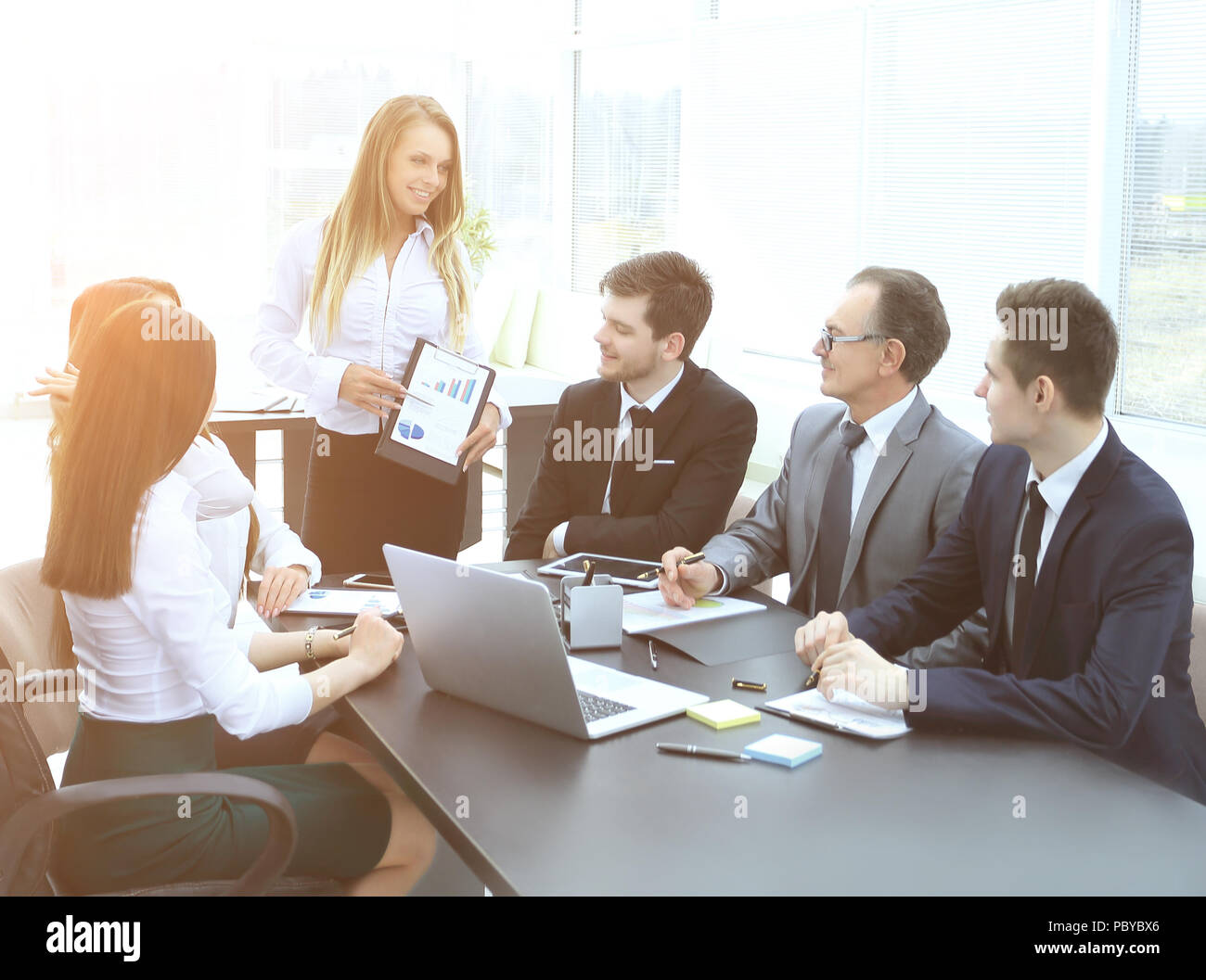 Manager discussing with business team new business plan Stock Photo - Alamy
