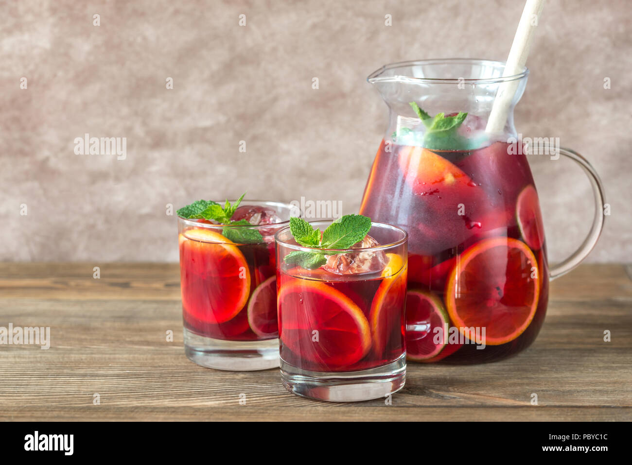 A pitcher and two glasses with Spanish fruit Sangria Stock Photo - Alamy