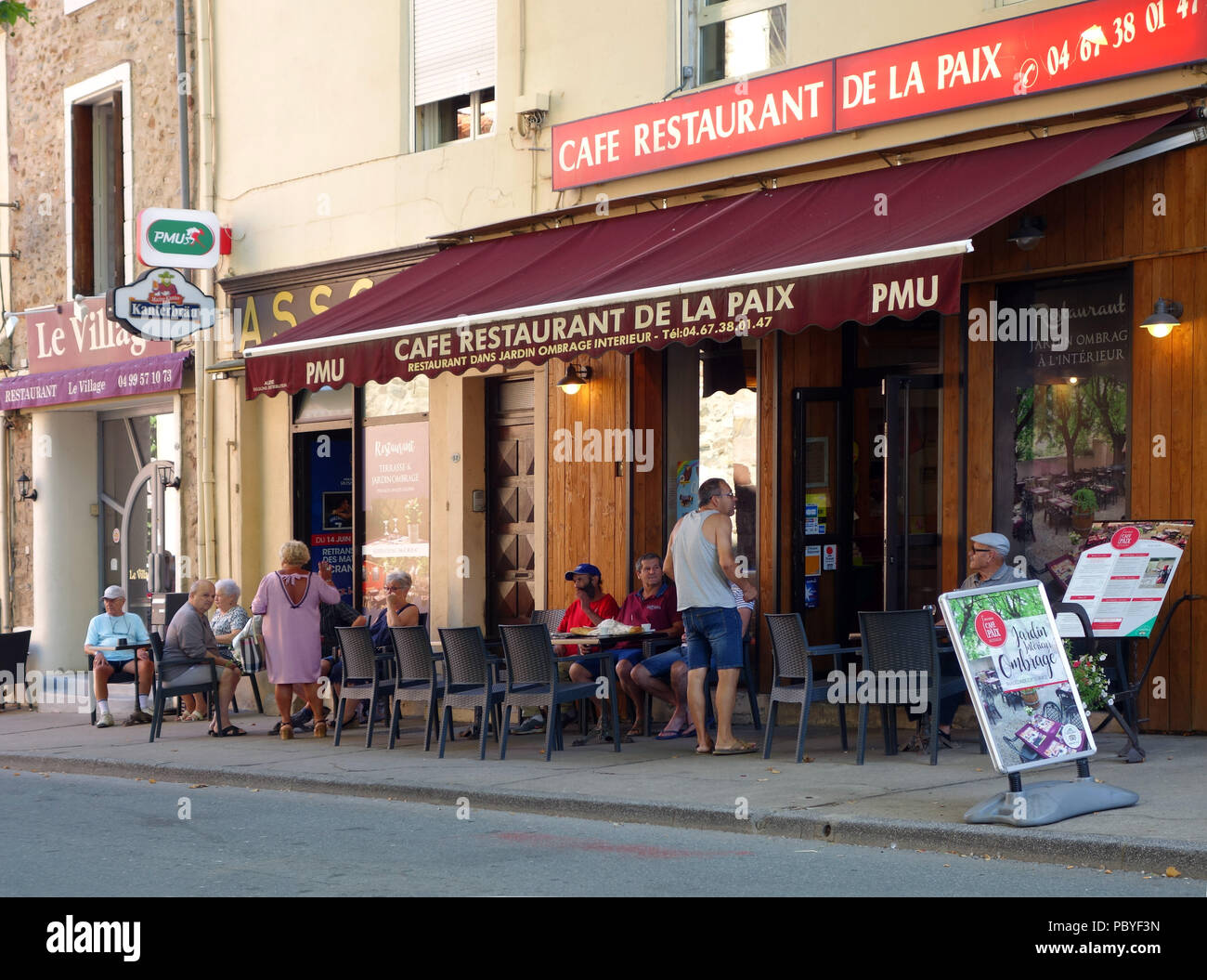 Colourful busy market at Saint Chinian Stock Photo - Alamy