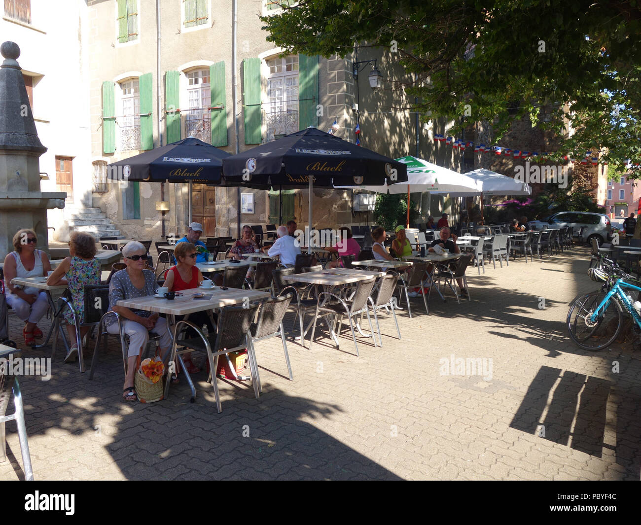 Colourful busy market at Saint Chinian french market Stock Photo - Alamy