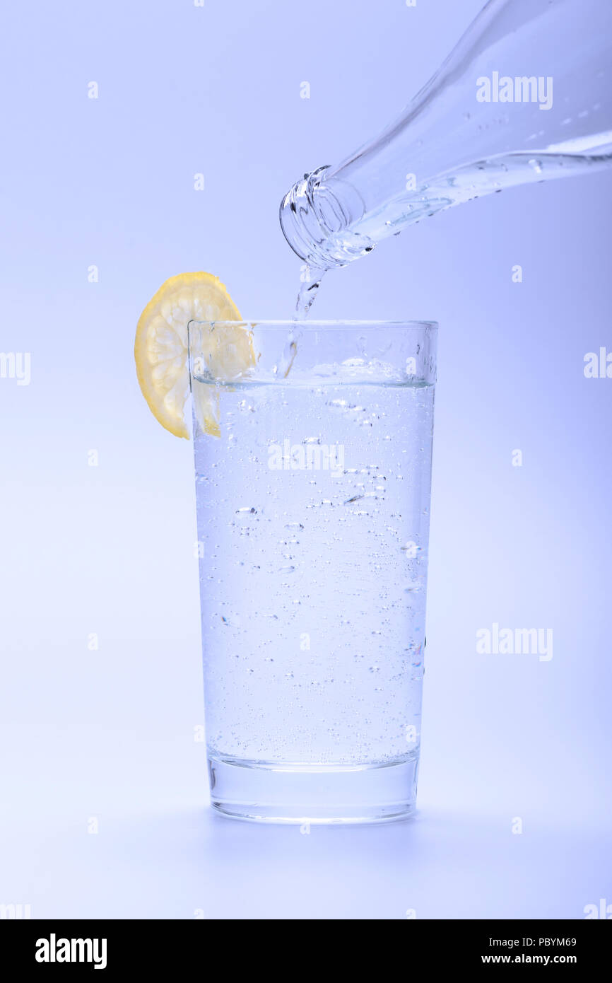 Bottle lemon pour in glass hi-res stock photography and images - Alamy