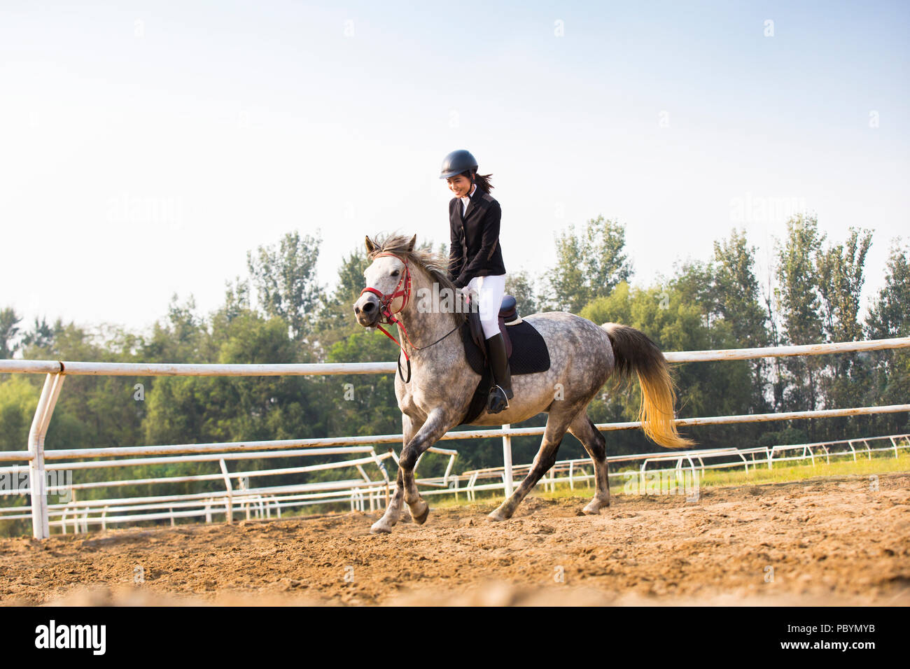 Chinese young woman riding horse hi-res stock photography and images ...