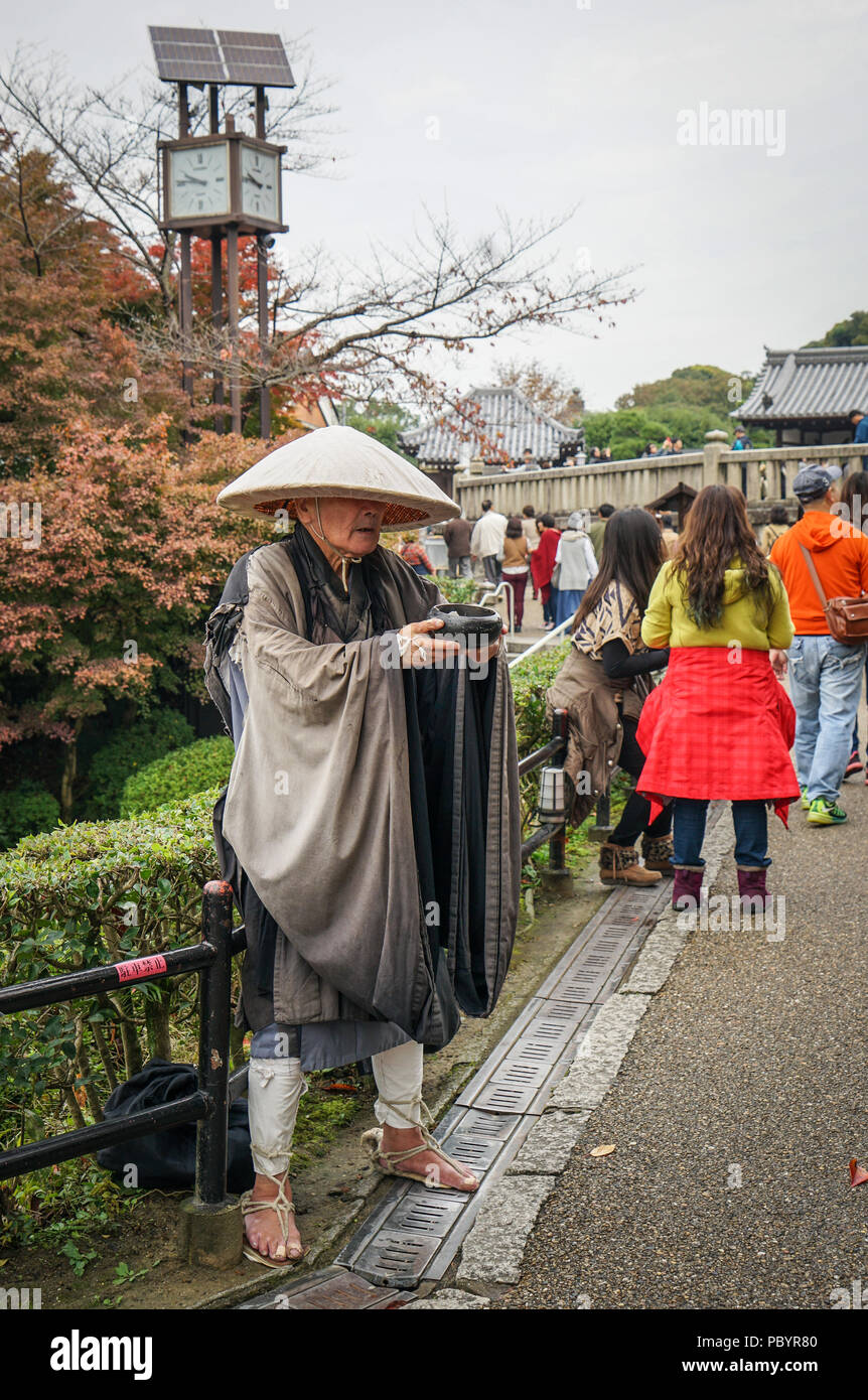 Kyoto, Japan - Nov 20, 2016. A Japanese monk waiting for a donation ...