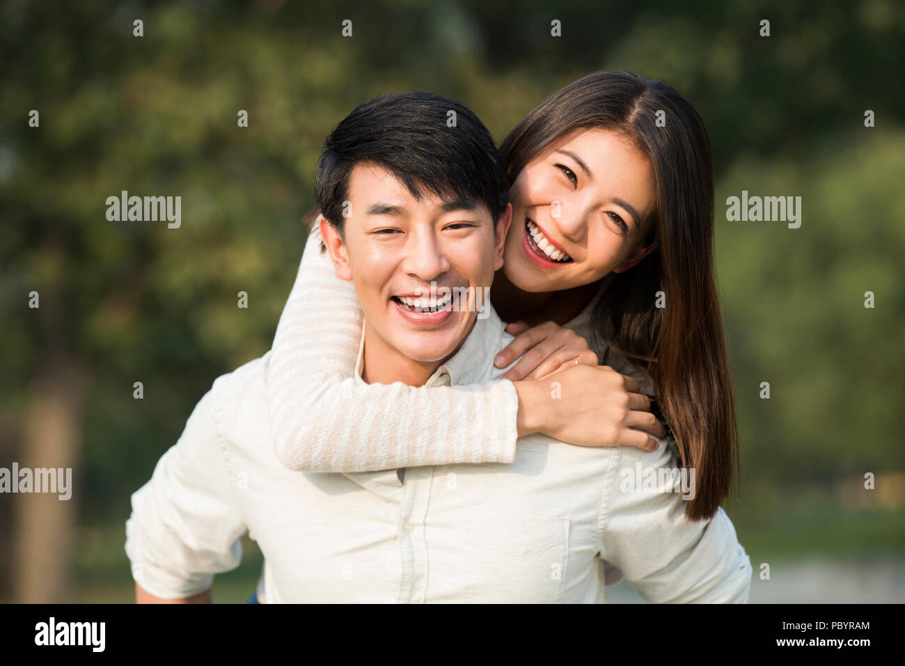 Cheerful young Chinese couple Stock Photo - Alamy