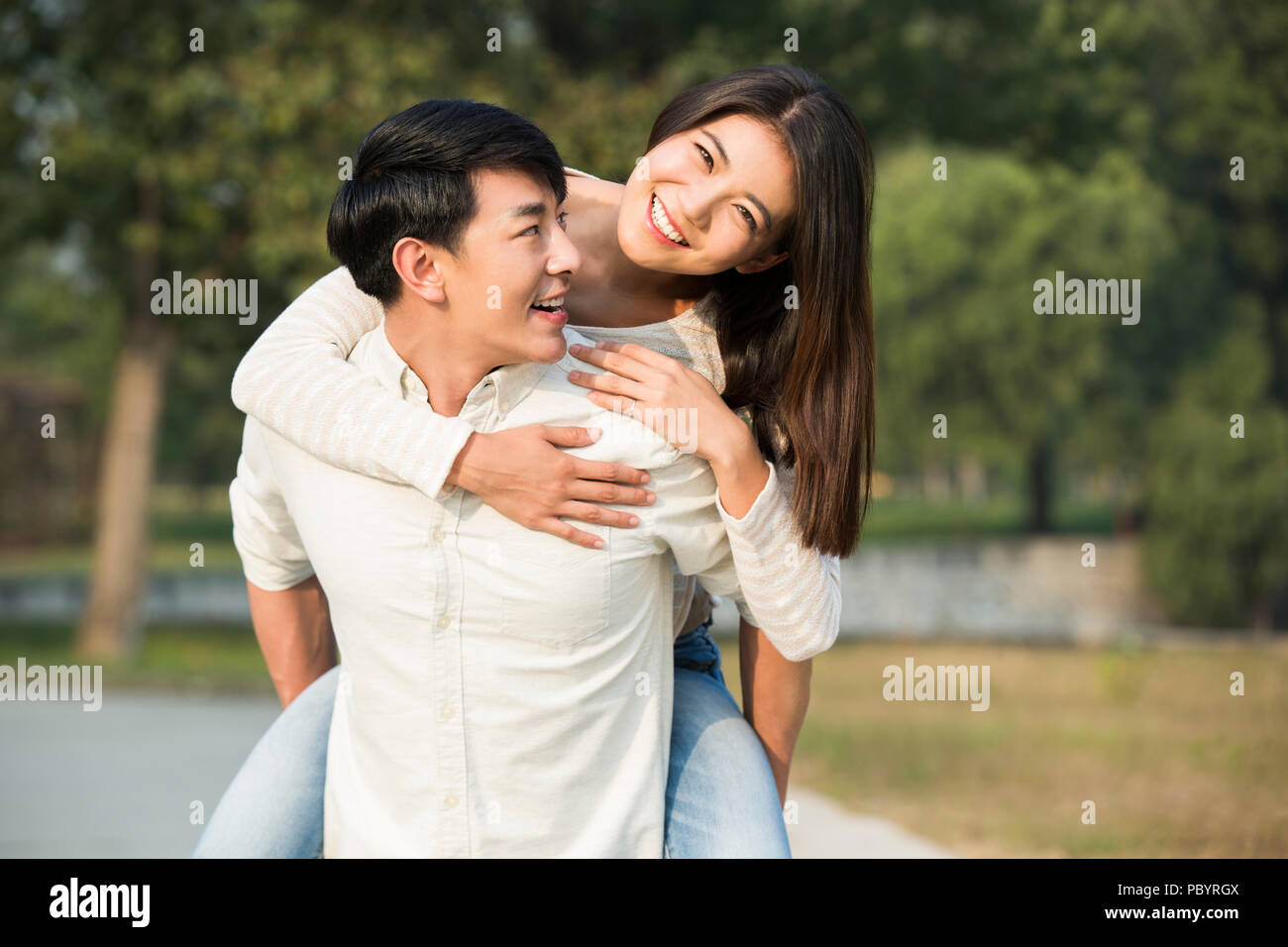 Cheerful young Chinese couple Stock Photo - Alamy