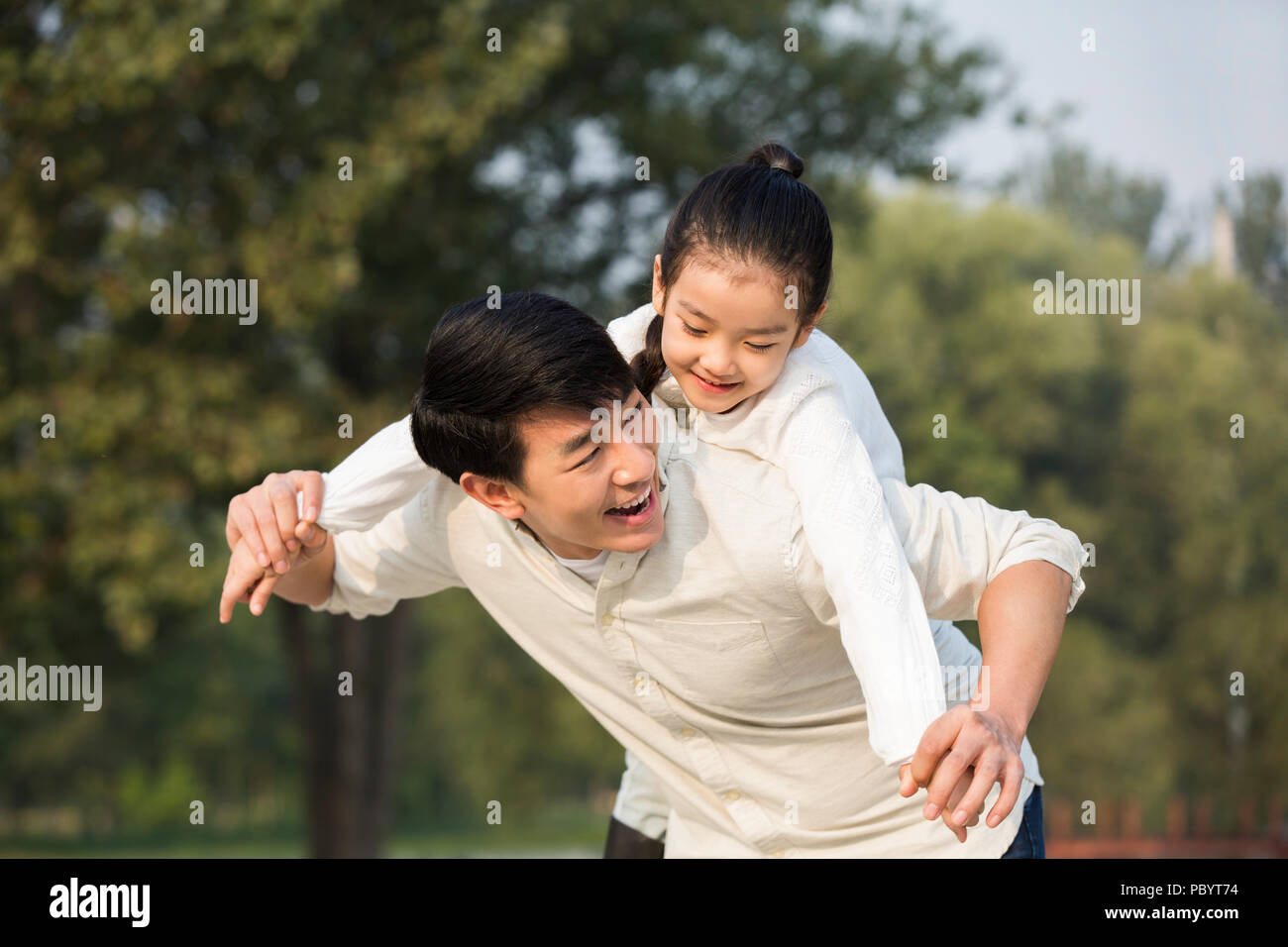 Cheerful Chinese father and daughter Stock Photo - Alamy