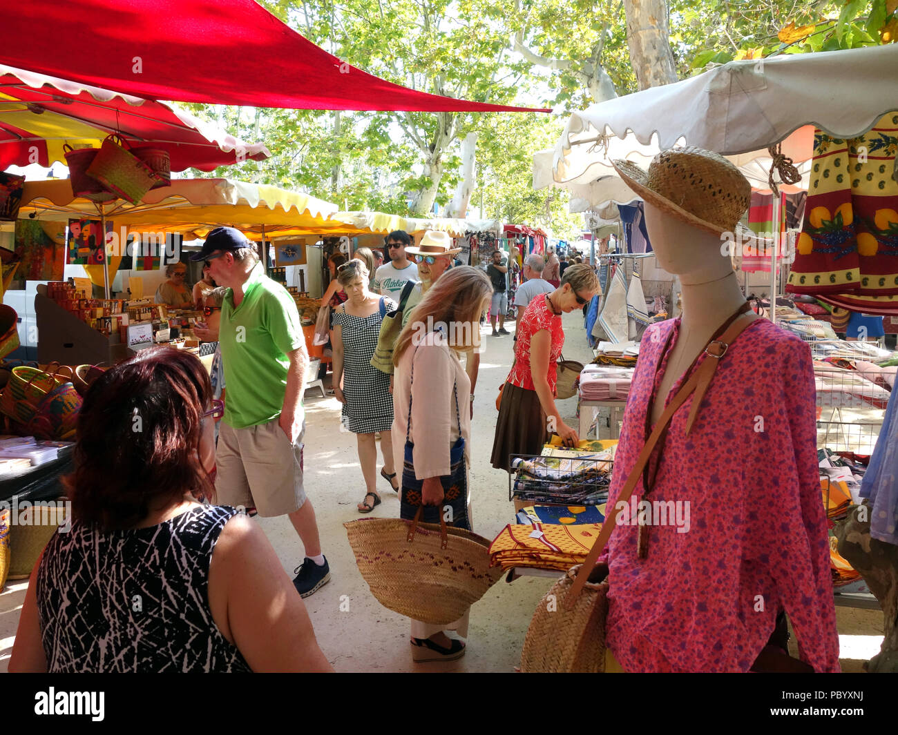 Colourful busy market at Saint Chinian french market Stock Photo - Alamy