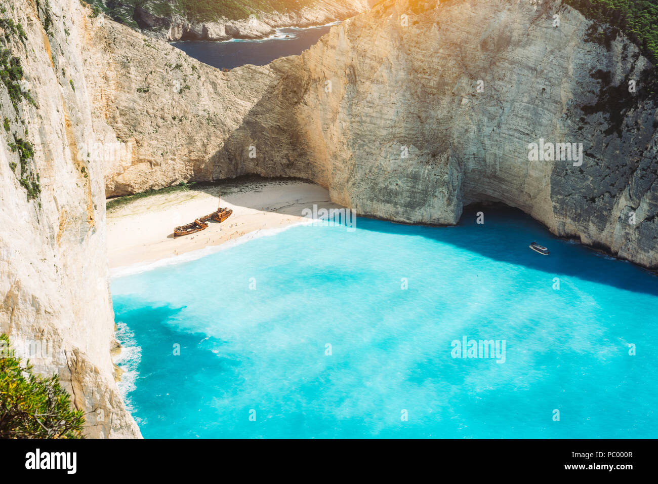 Shipwreck on Navagio beach with turquoise blue sea water surrounded by ...