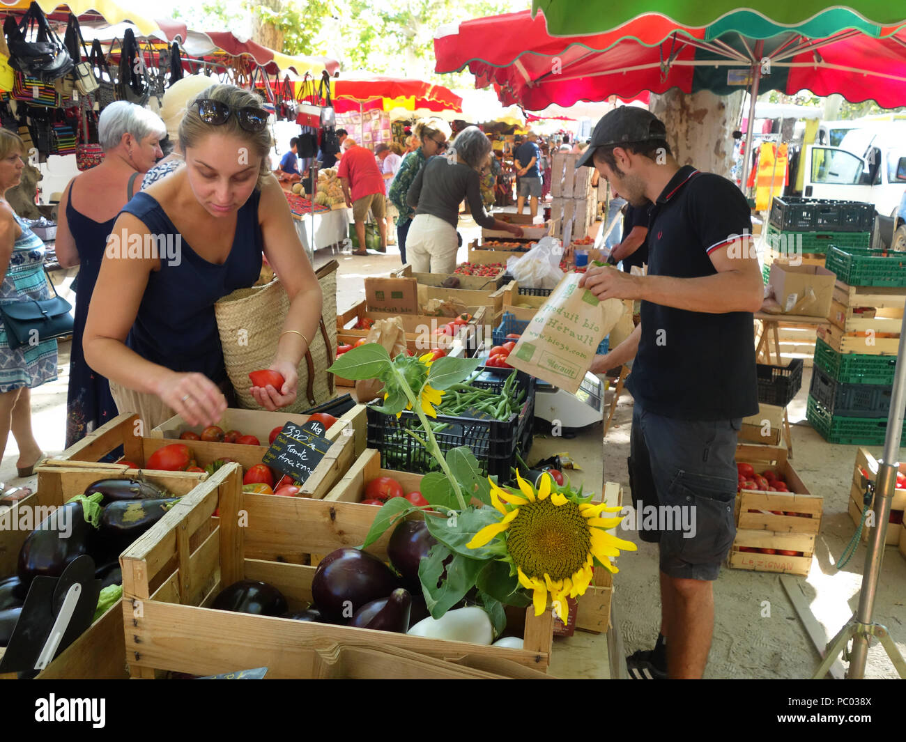 Colourful busy market at Saint Chinian french market Stock Photo - Alamy
