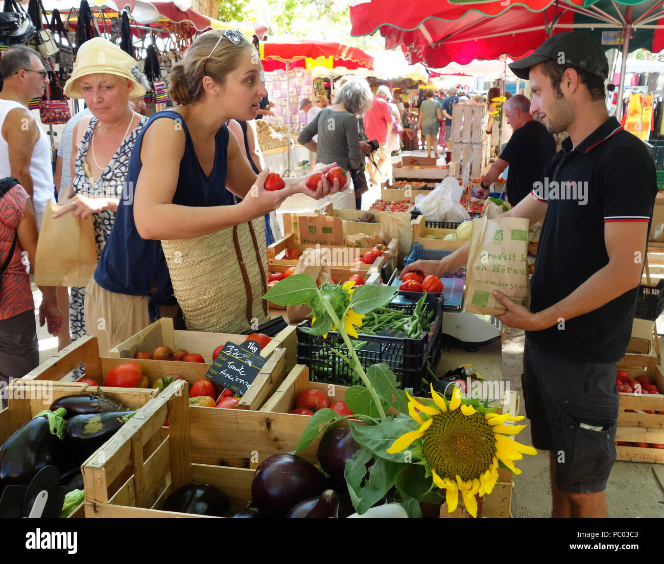 Colourful busy market at Saint Chinian french market Stock Photo - Alamy
