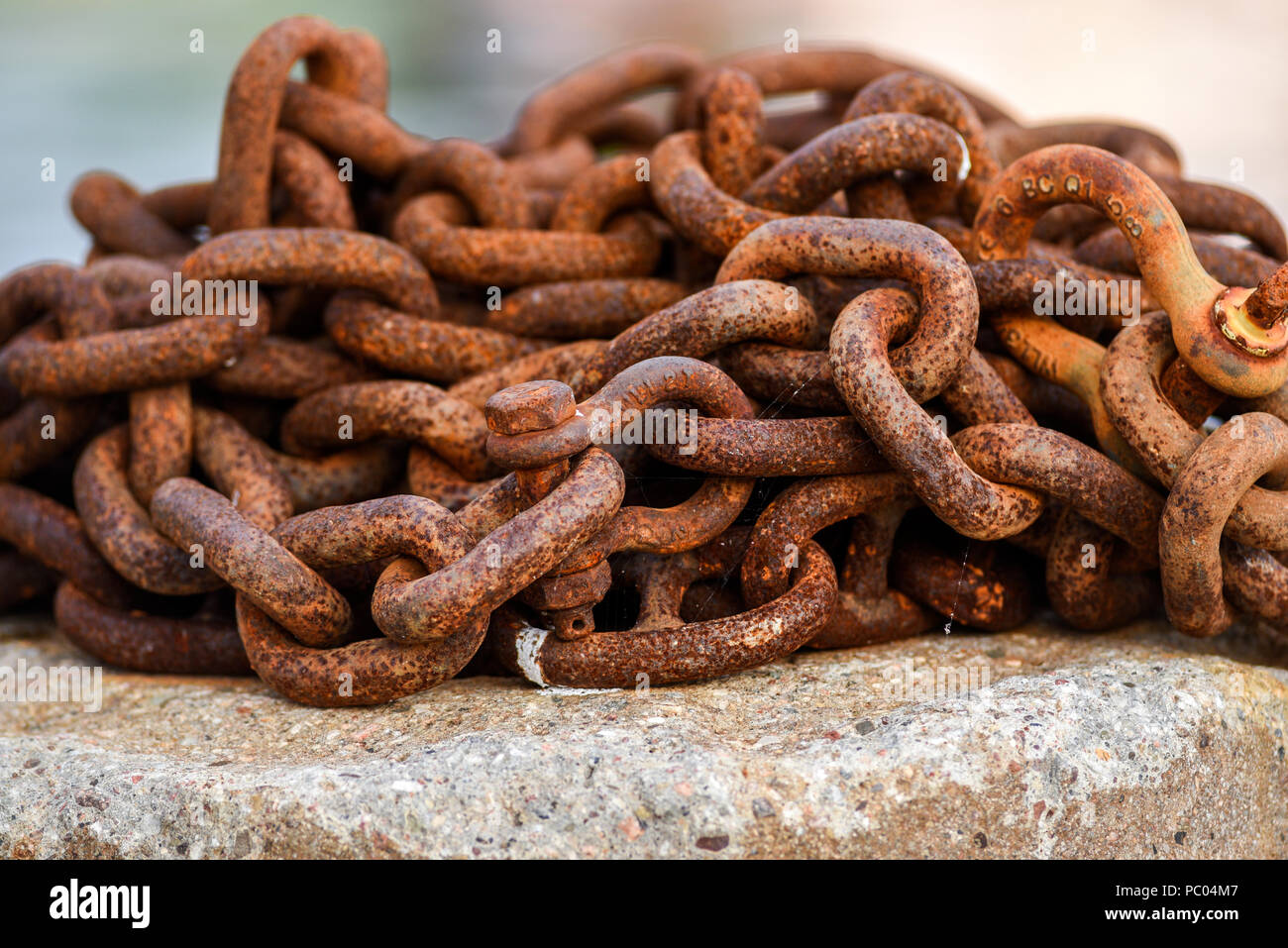 Old and rusty harbor chains Stock Photo - Alamy