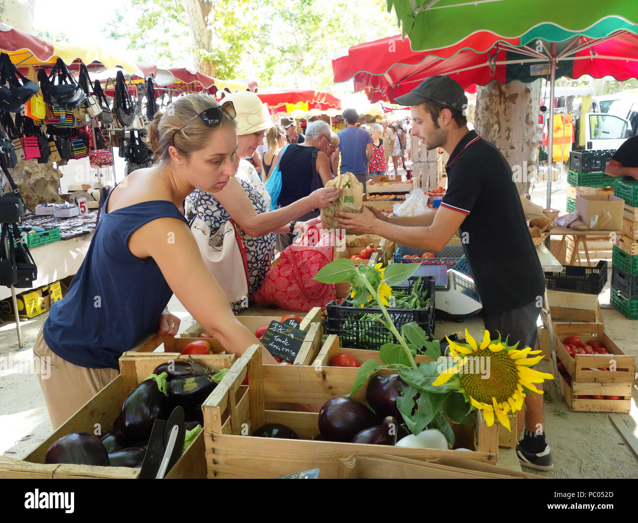 Colourful busy market at Saint Chinian french market Stock Photo - Alamy