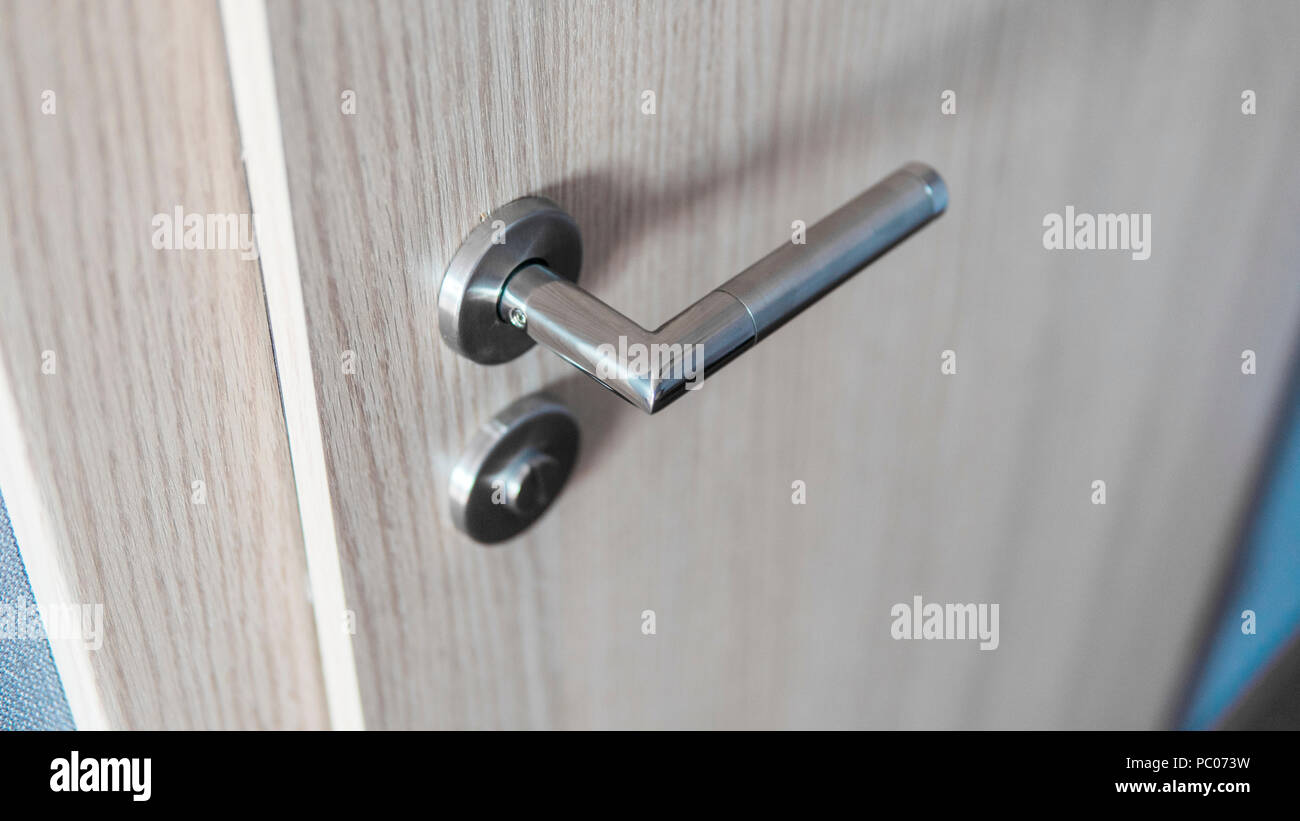 Door handle and inner lock on a wooden doors Stock Photo - Alamy