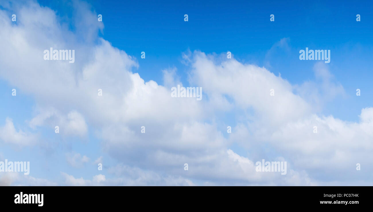 Panoramic blue sky background with white cumulus clouds, natural photo ...